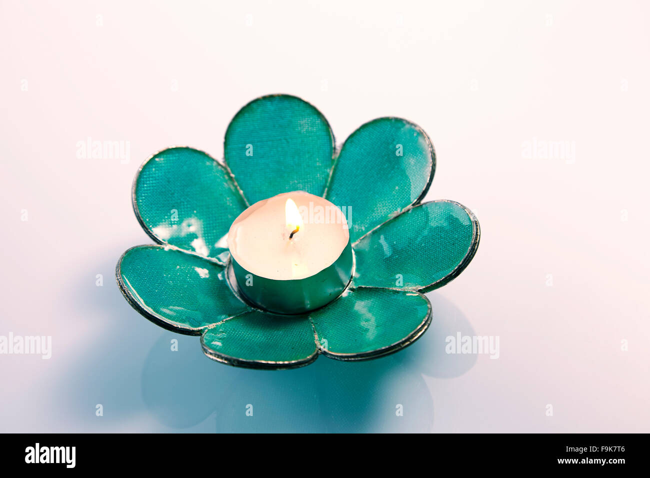 tea light on the floral design holder Stock Photo - Alamy