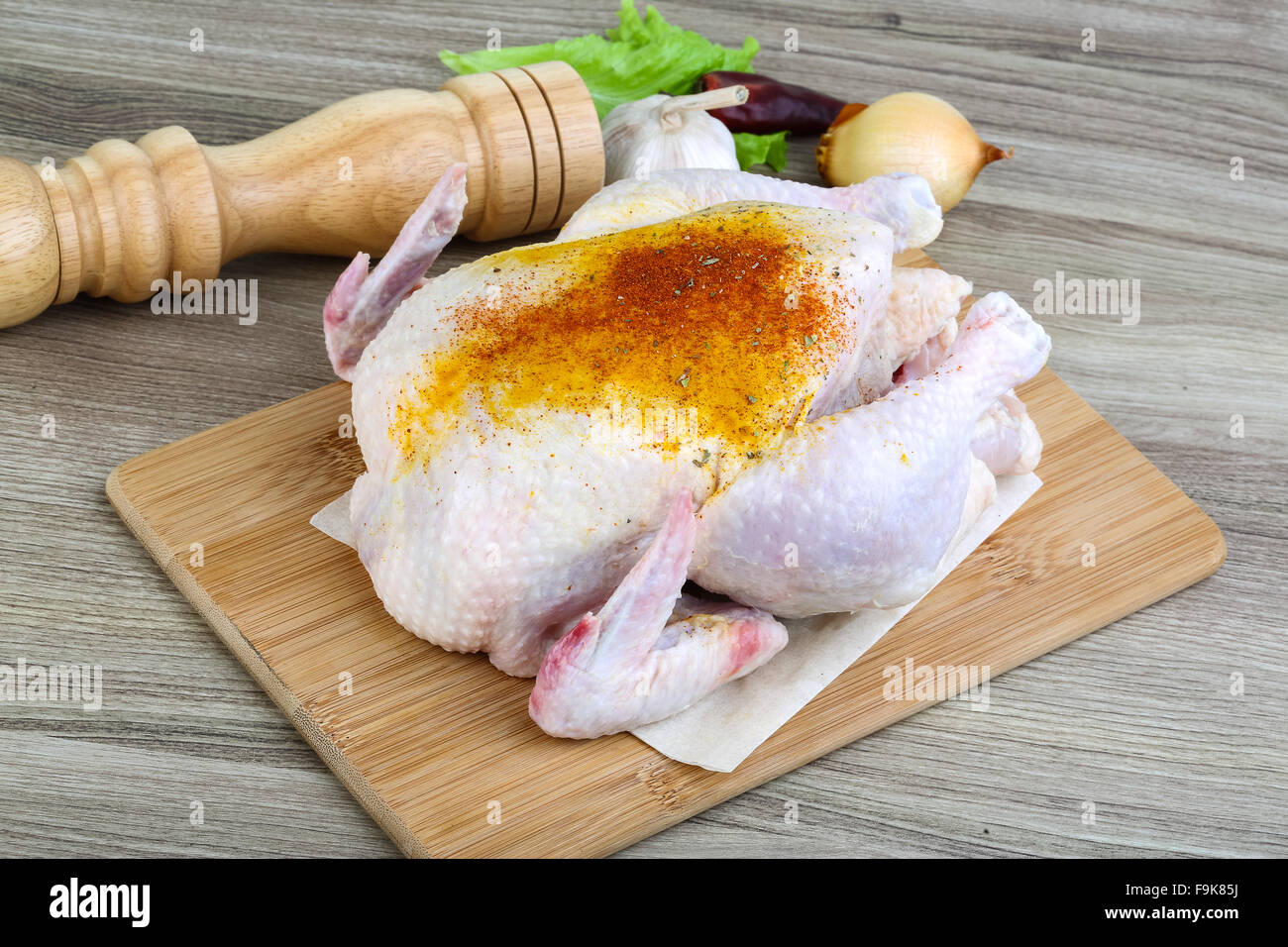 Raw chicken with spices ready for cooking Stock Photo - Alamy