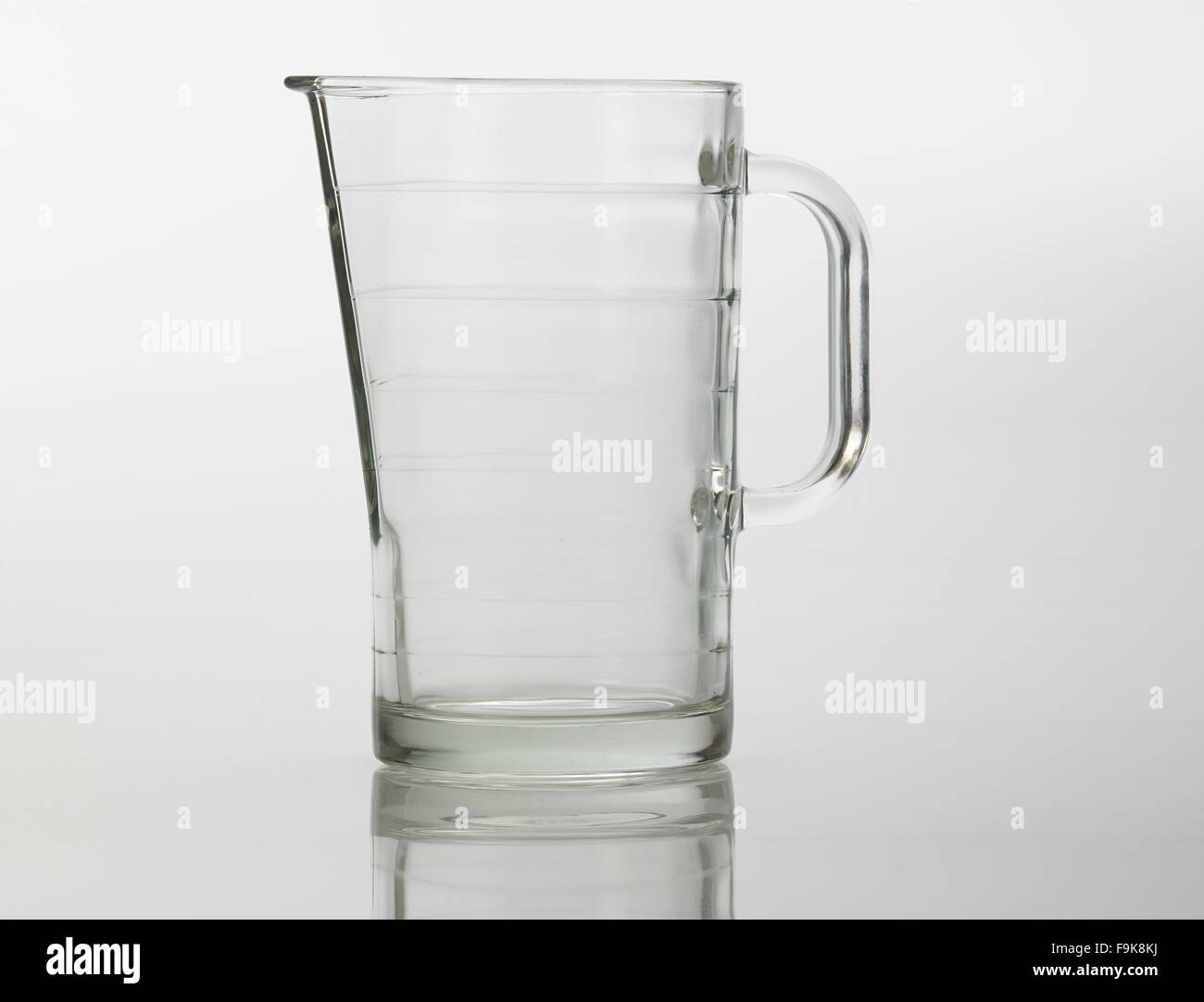 Empty pitcher for juice or milk on white background Stock Photo - Alamy
