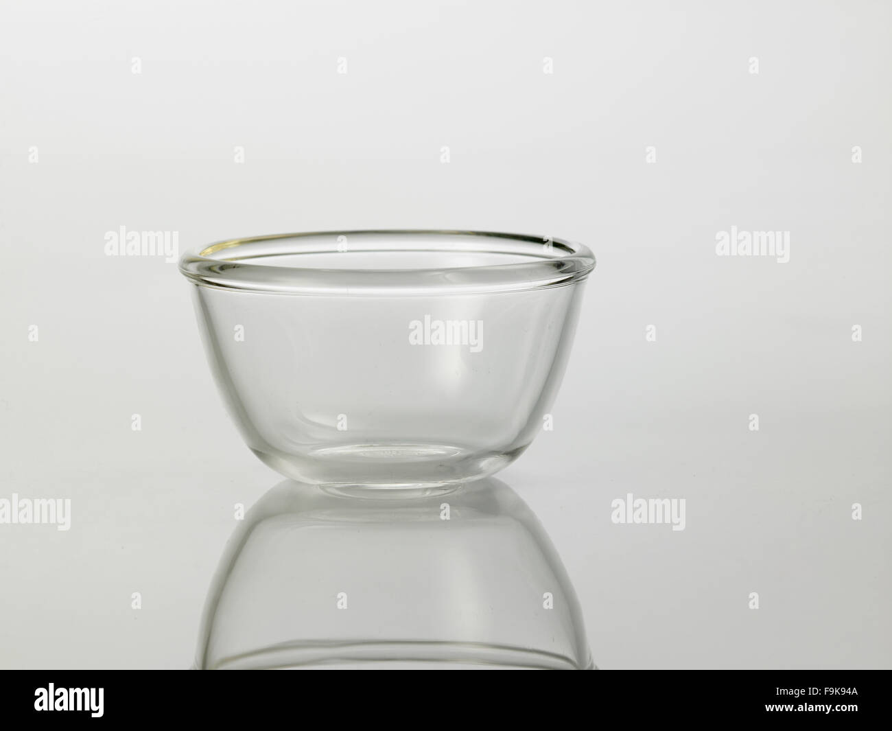 Empty glass bowl on white background Stock Photo - Alamy