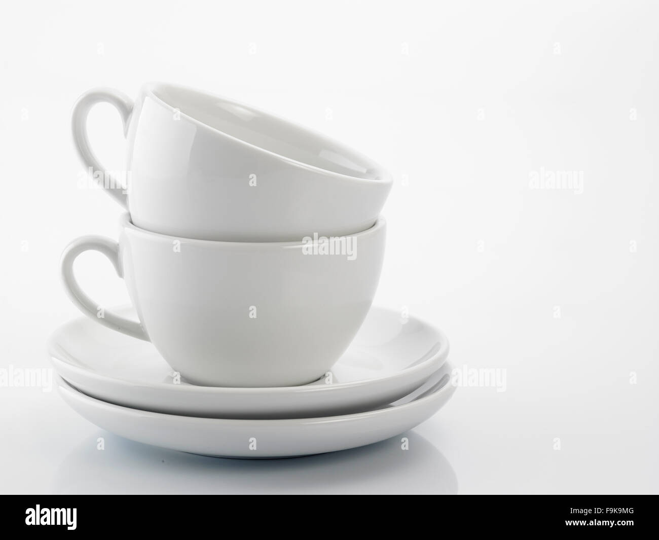 two white coffee cup on the white background Stock Photo - Alamy