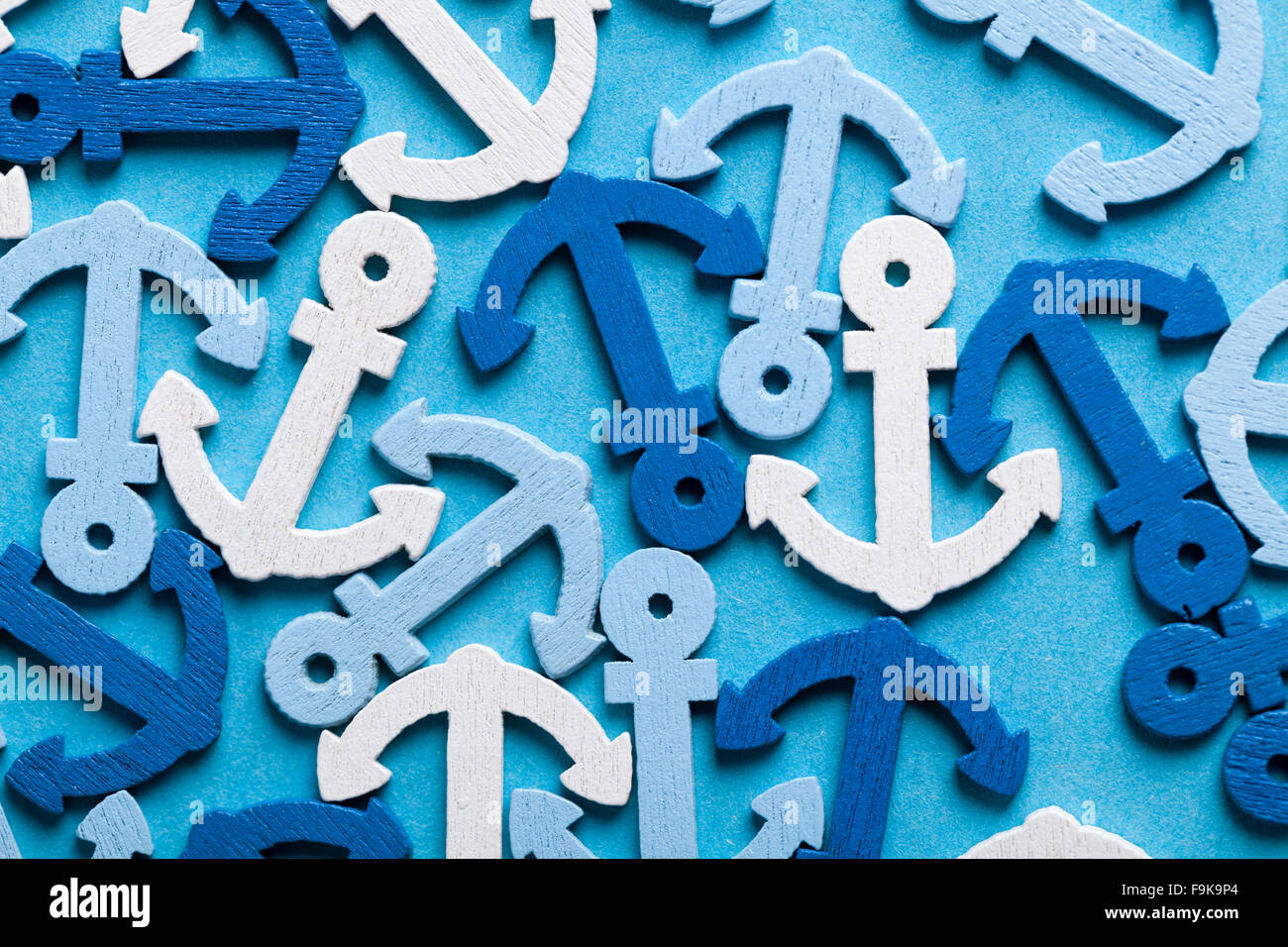 the small anchor close-up on a blue background Stock Photo - Alamy