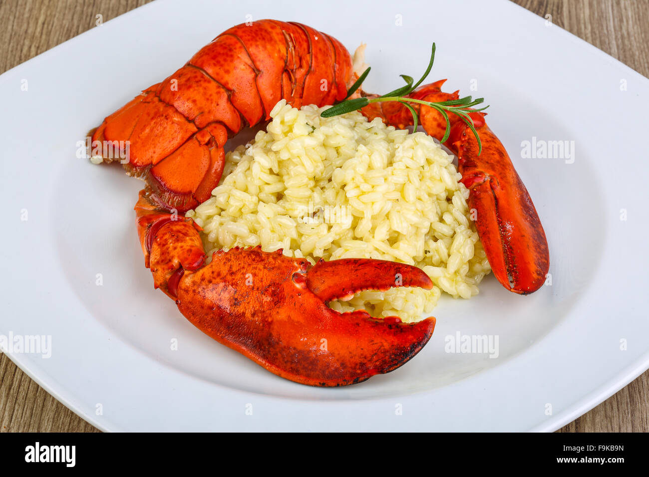 Delicous Risotto with lobster served rosemary and parmesan Stock Photo ...