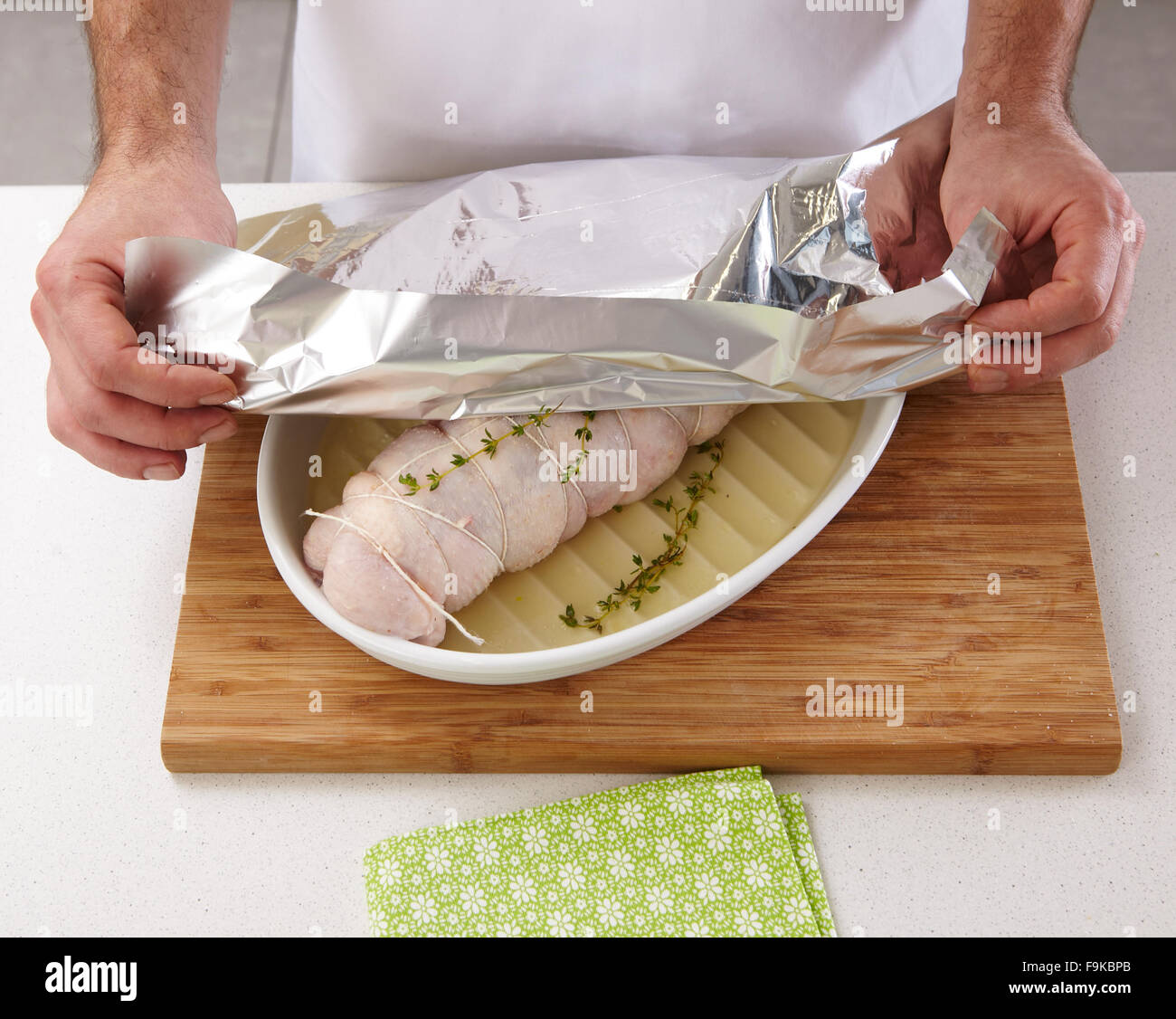 Dried tomato filled rolled chicken + steps Stock Photo - Alamy