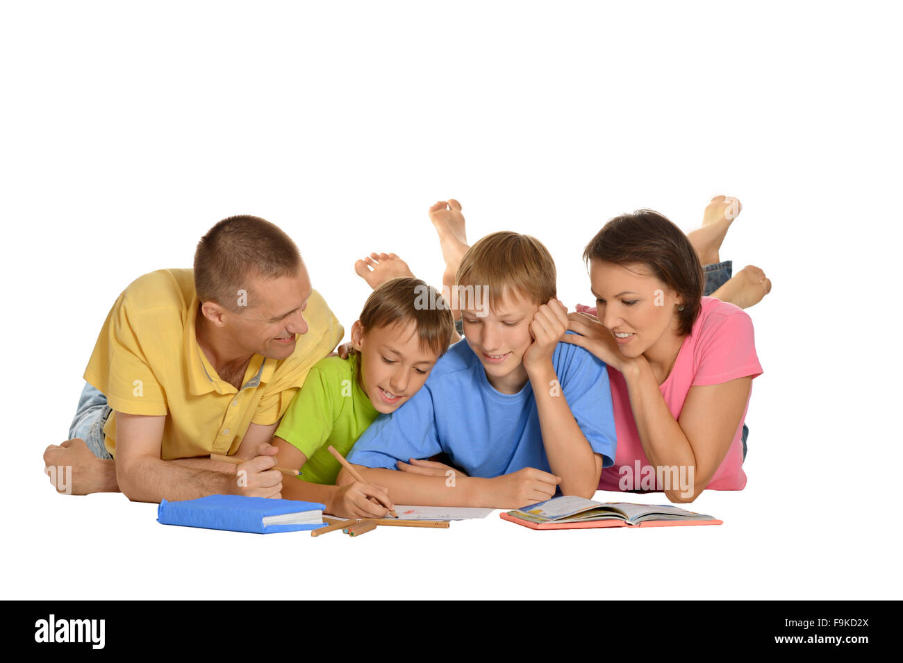 Parents help children do homework Stock Photo - Alamy
