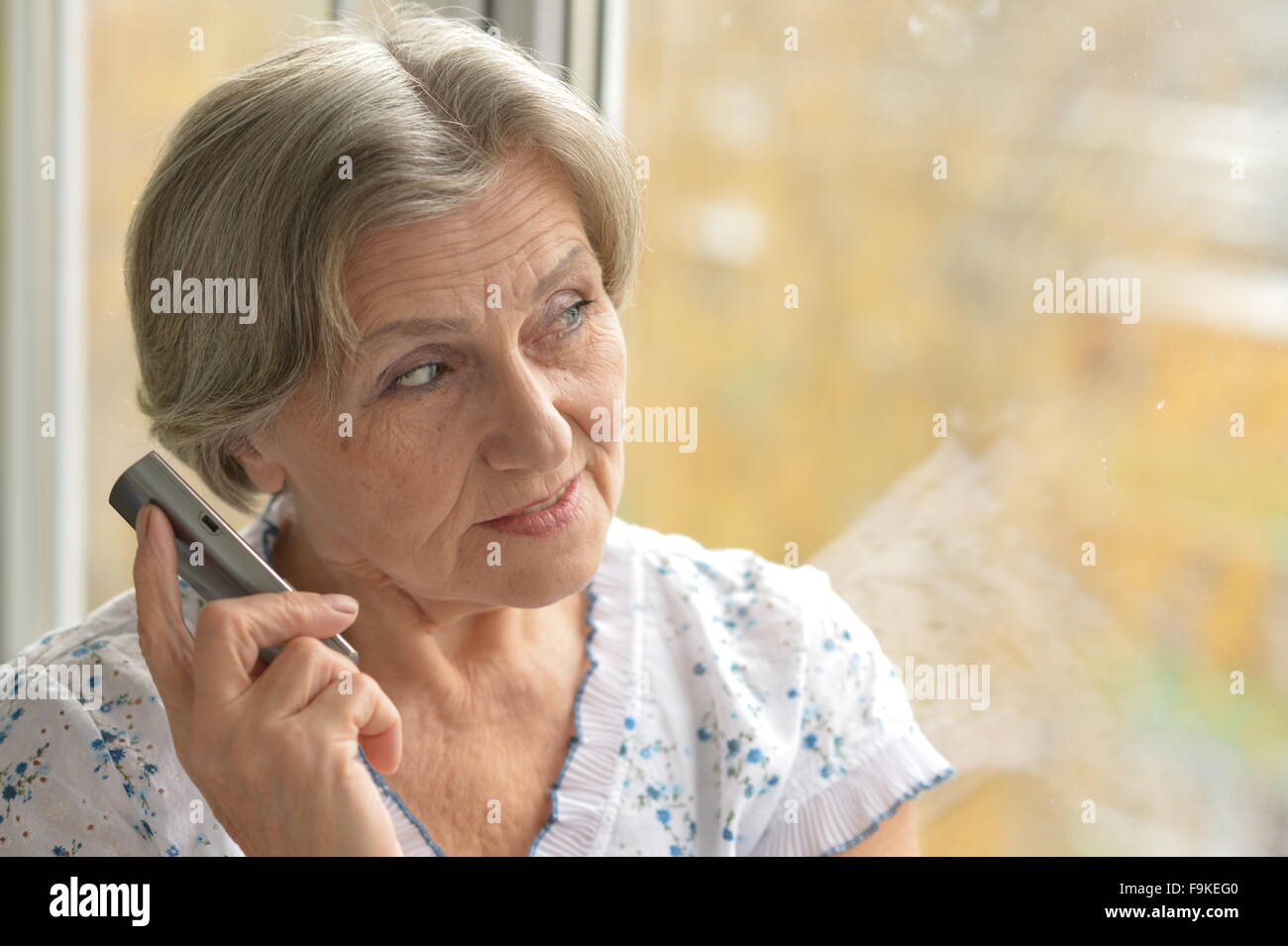 woman calling at home Stock Photo - Alamy