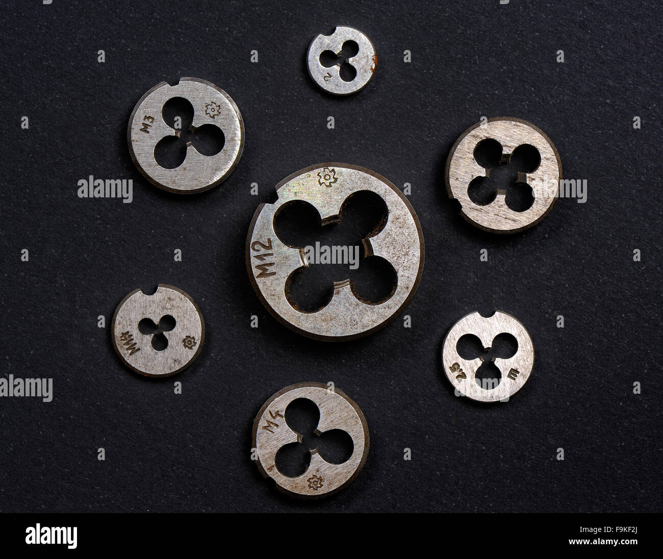 Old threading tools on dark background, close-up Stock Photo - Alamy