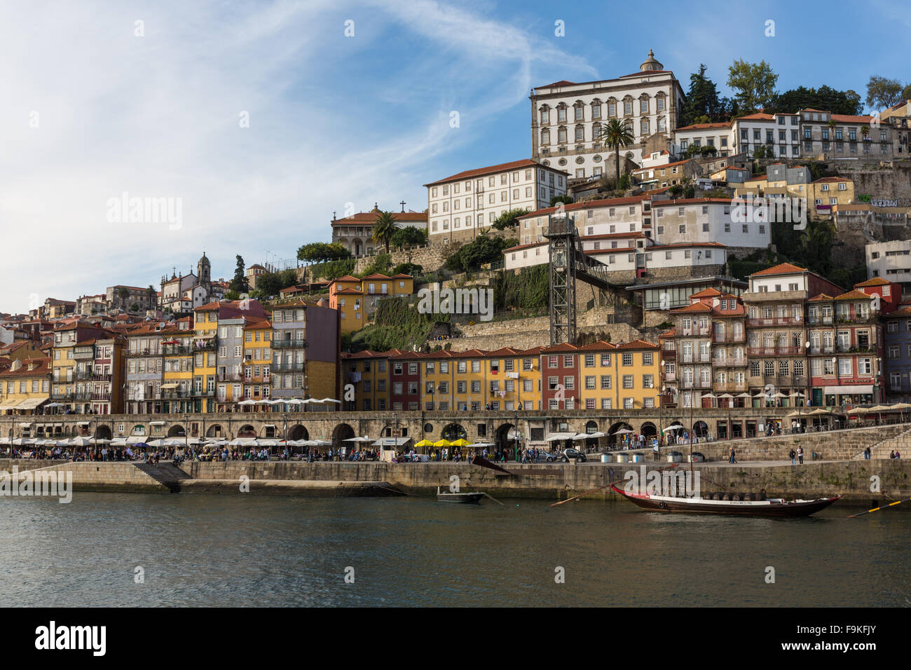 View of Porto city at the riverbank (Ribeira quarter) and wine boats ...