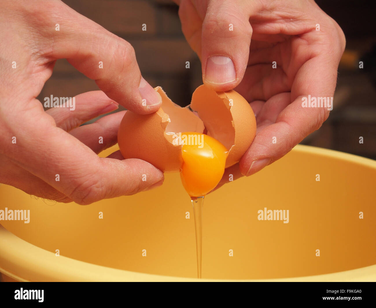 Cracking eggs into mixing bowl. Making yeast pancakes (crepes Stock ...