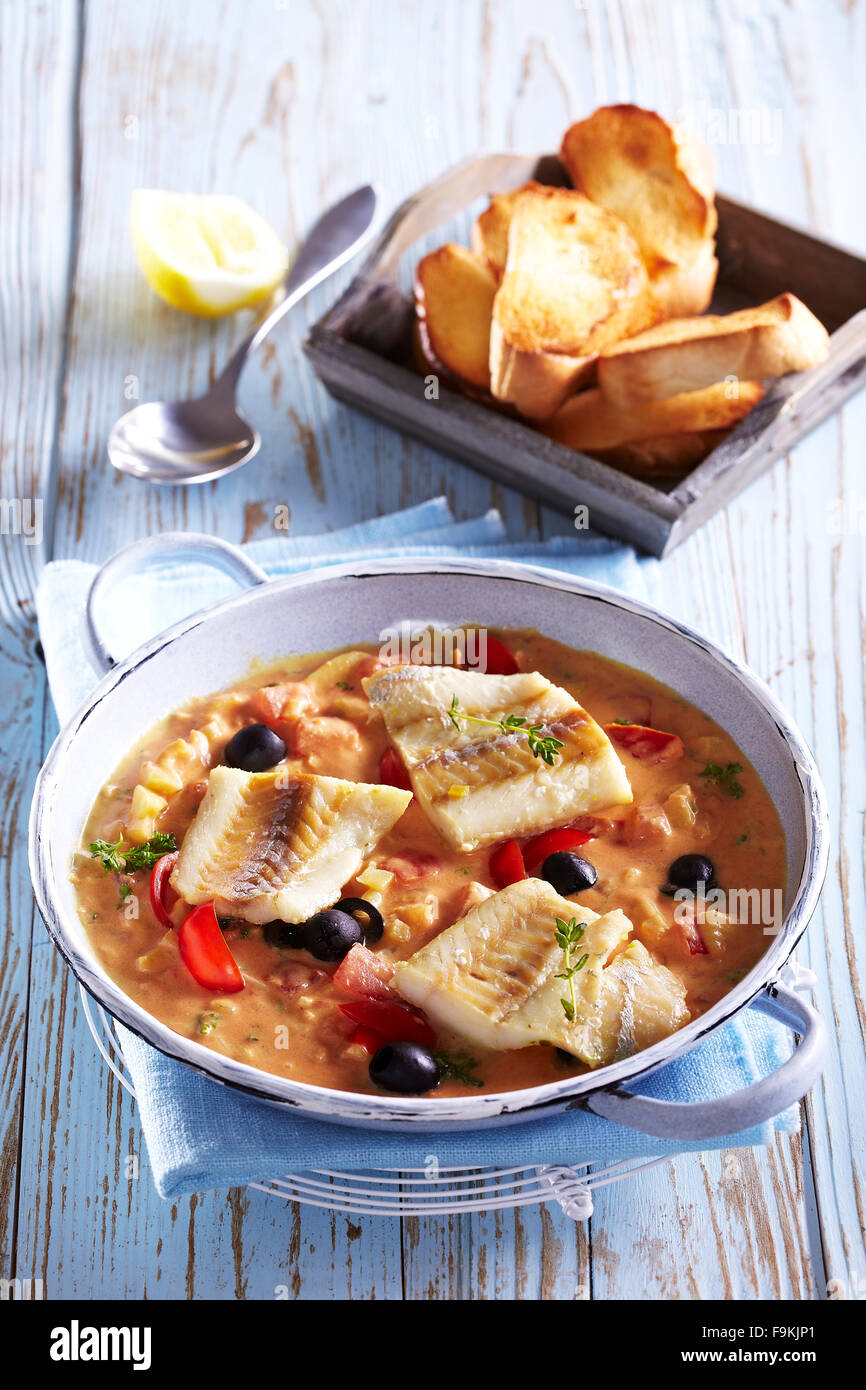 Fish and tomato ragout Stock Photo - Alamy