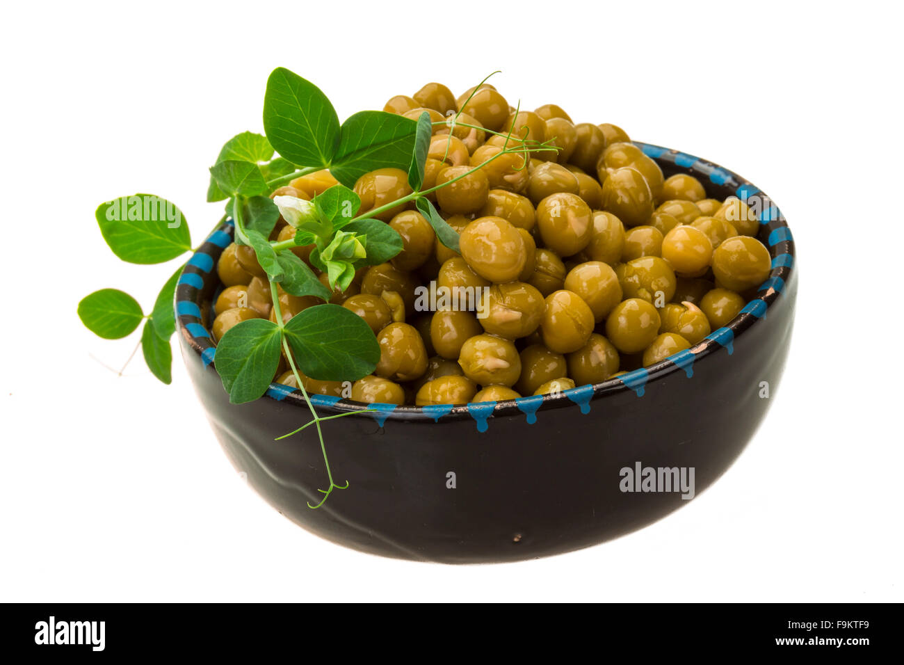 Marinated green peas with branch Stock Photo - Alamy