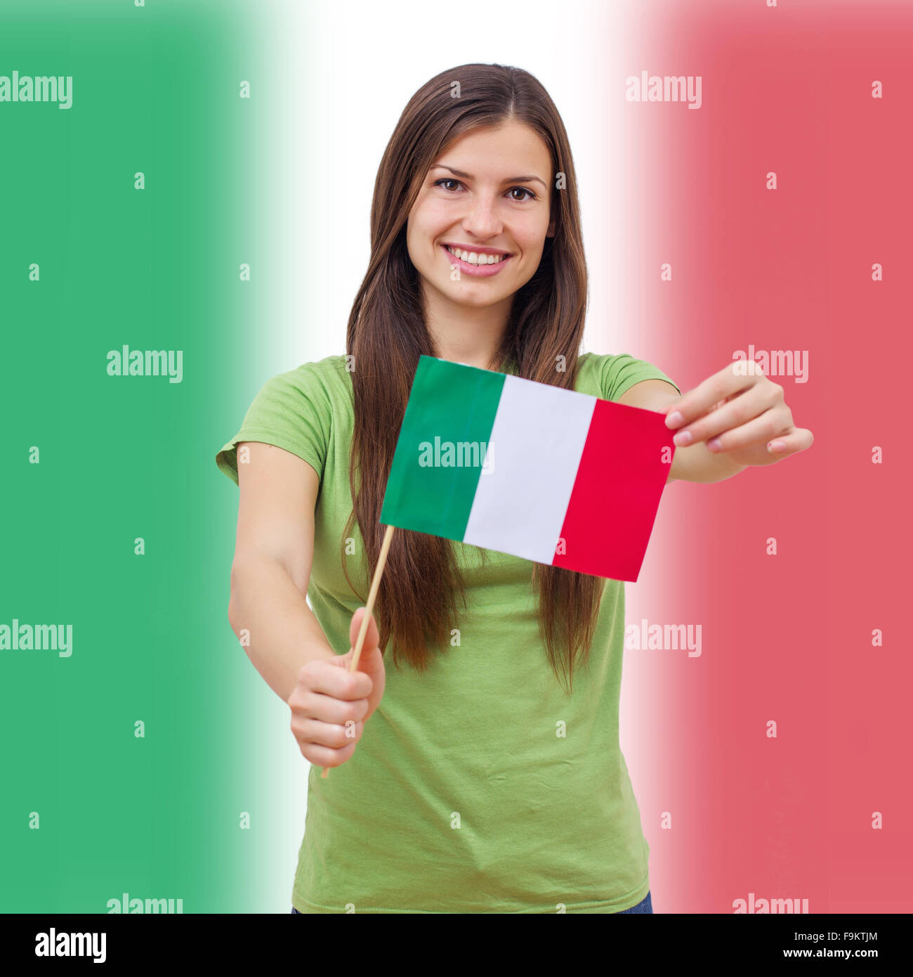 Beautiful smiling young woman holding Italian flag Stock Photo - Alamy