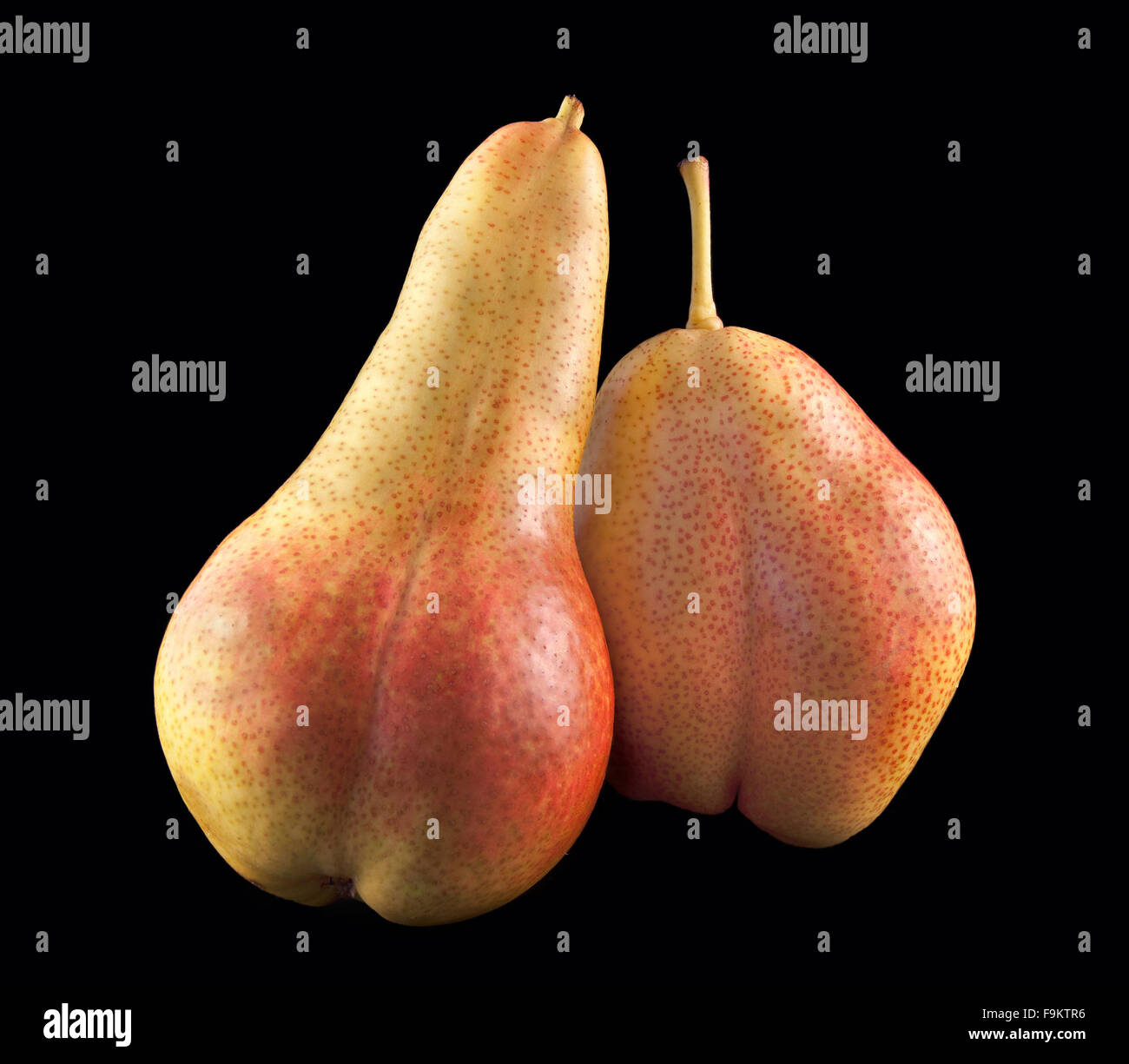Two pears on the black background Stock Photo - Alamy