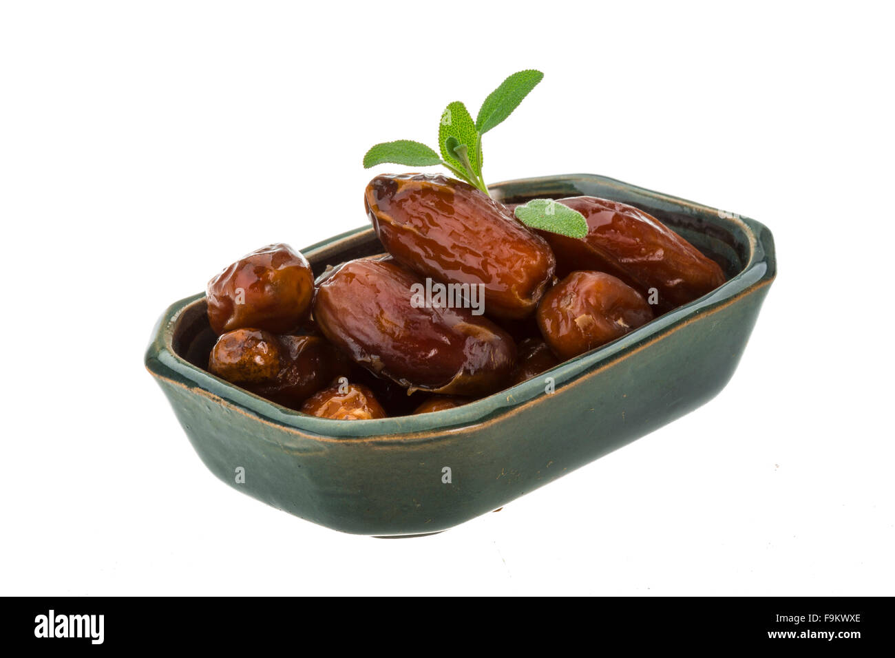 Dates with leaf on the plate Stock Photo - Alamy