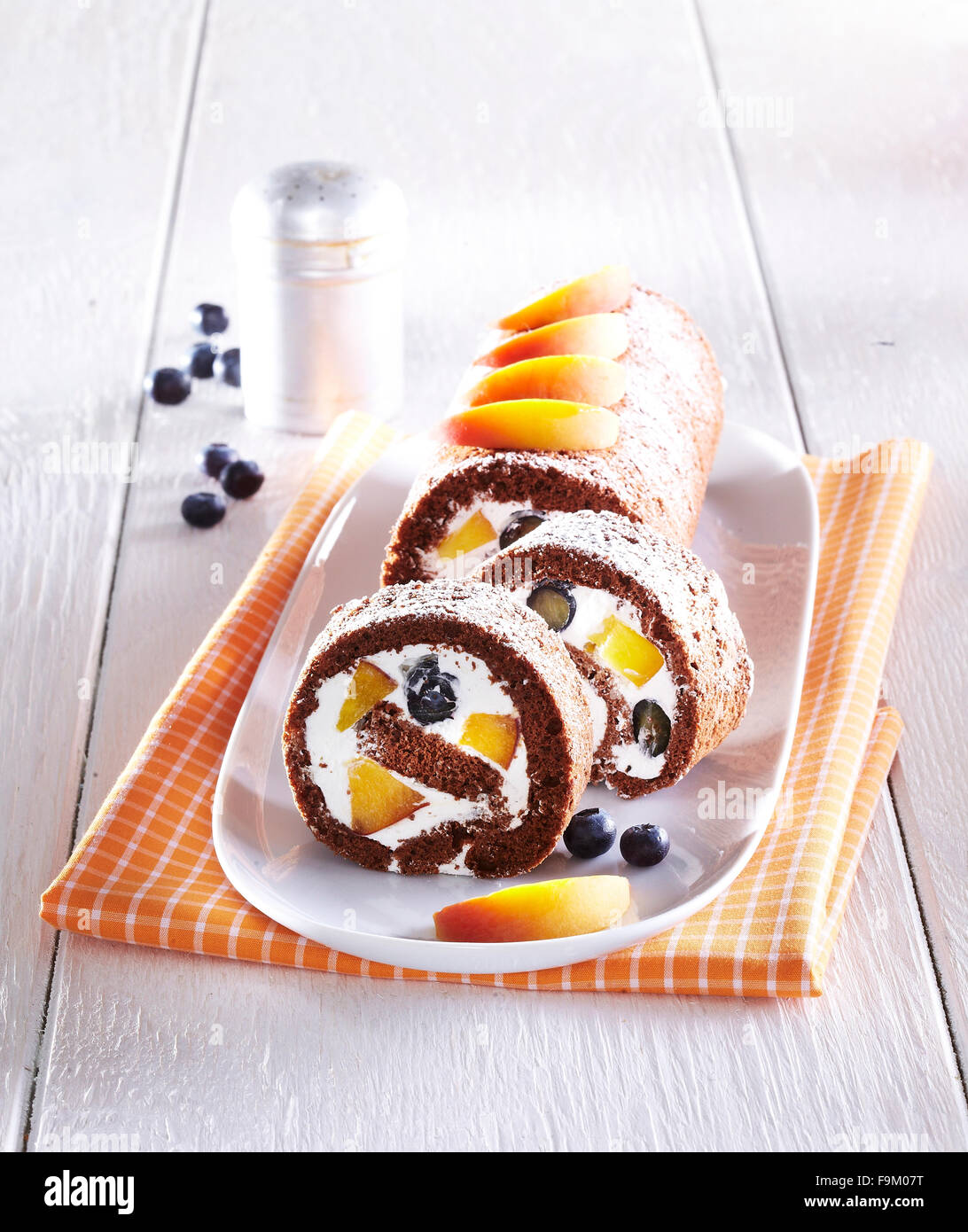 Peach and blueberry roulade Stock Photo - Alamy