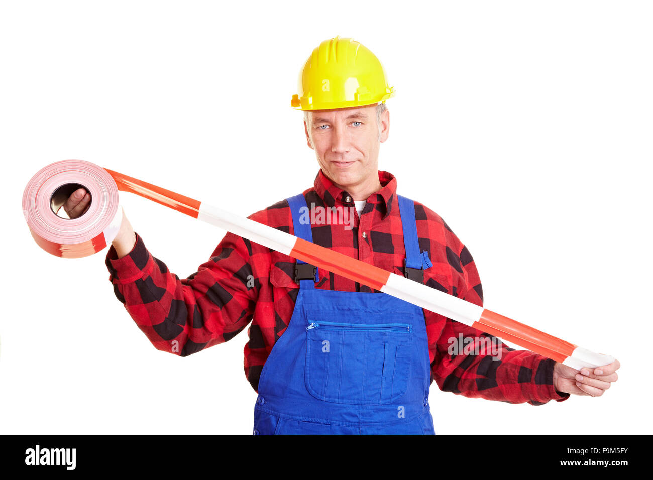 Senior construction worker holding striped barrier tape Stock Photo - Alamy