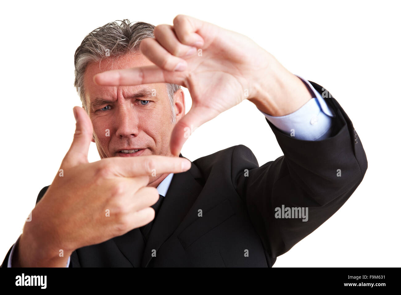Senior manager making a frame with his fingers Stock Photo - Alamy