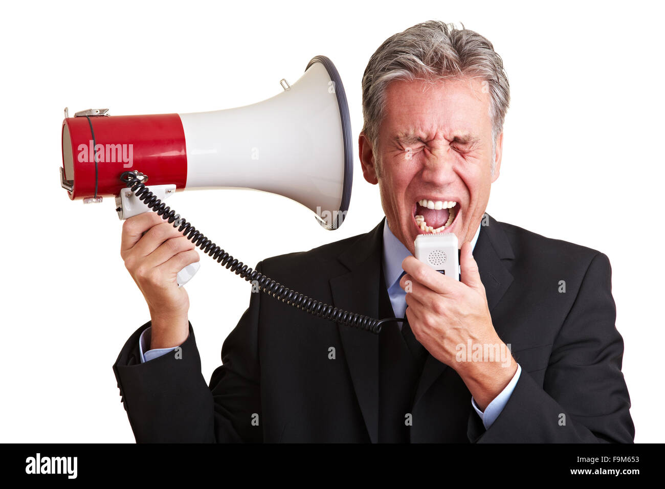 Elderly business man screaming loudly in a megaphone Stock Photo - Alamy