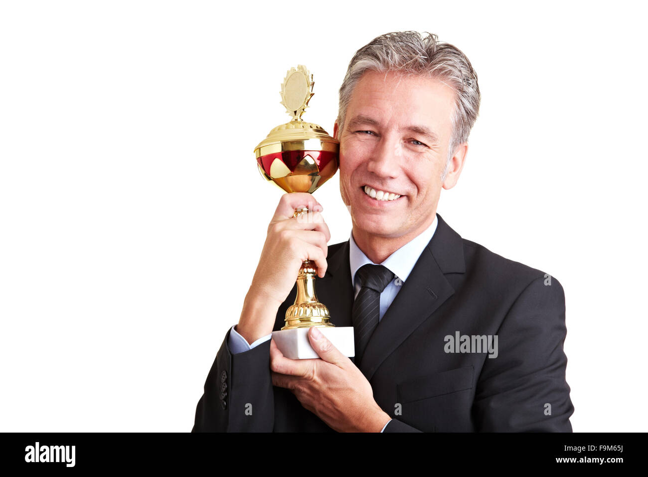 Business man holding trophy in hi-res stock photography and images - Alamy