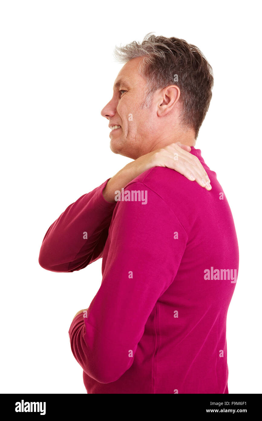 Elderly man with back pain holding his aching shoulder Stock Photo - Alamy