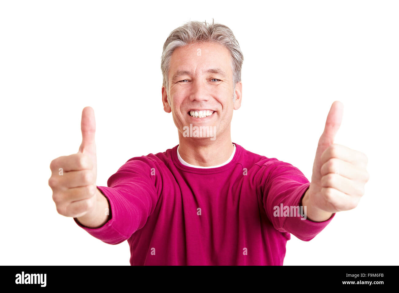 Smiling senior man holding both thumbs up Stock Photo - Alamy