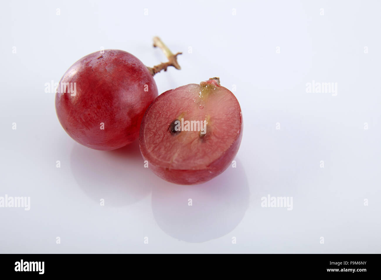 red grape isolated on white Stock Photo - Alamy