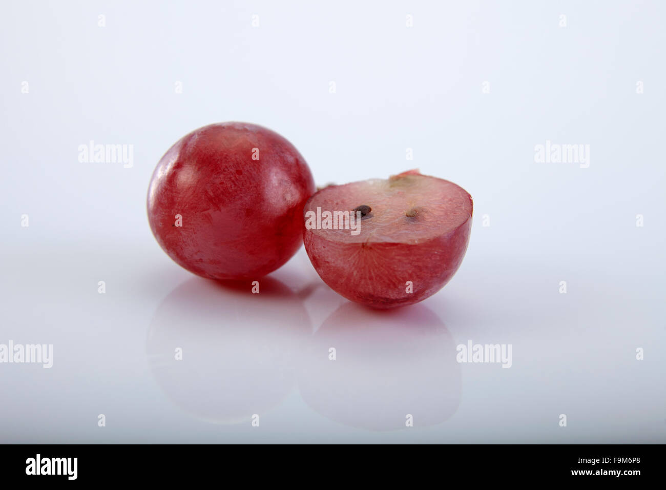 red grape isolated on white Stock Photo - Alamy