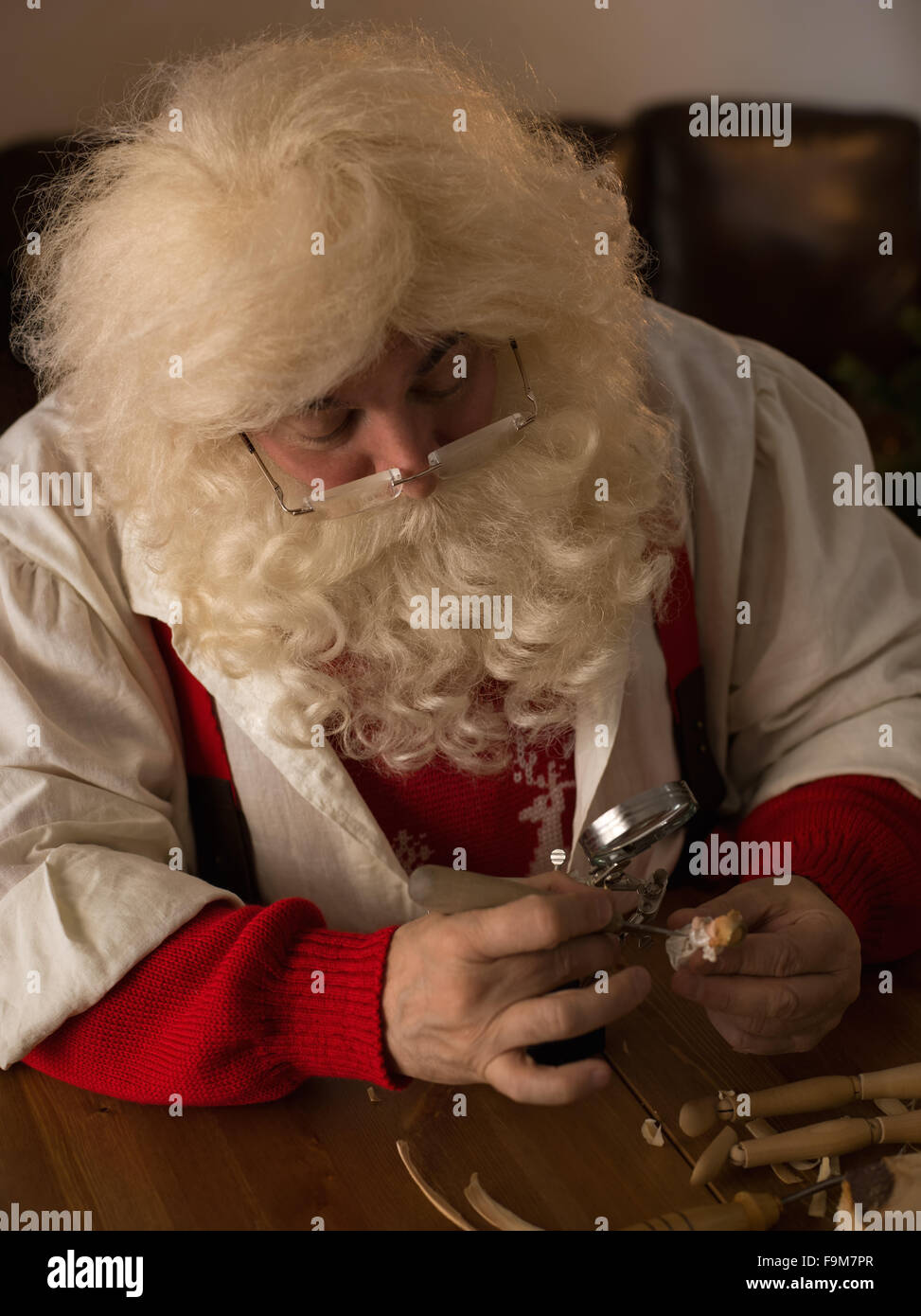 Santa Claus Working at Home. Making Toys for Children Stock Photo - Alamy