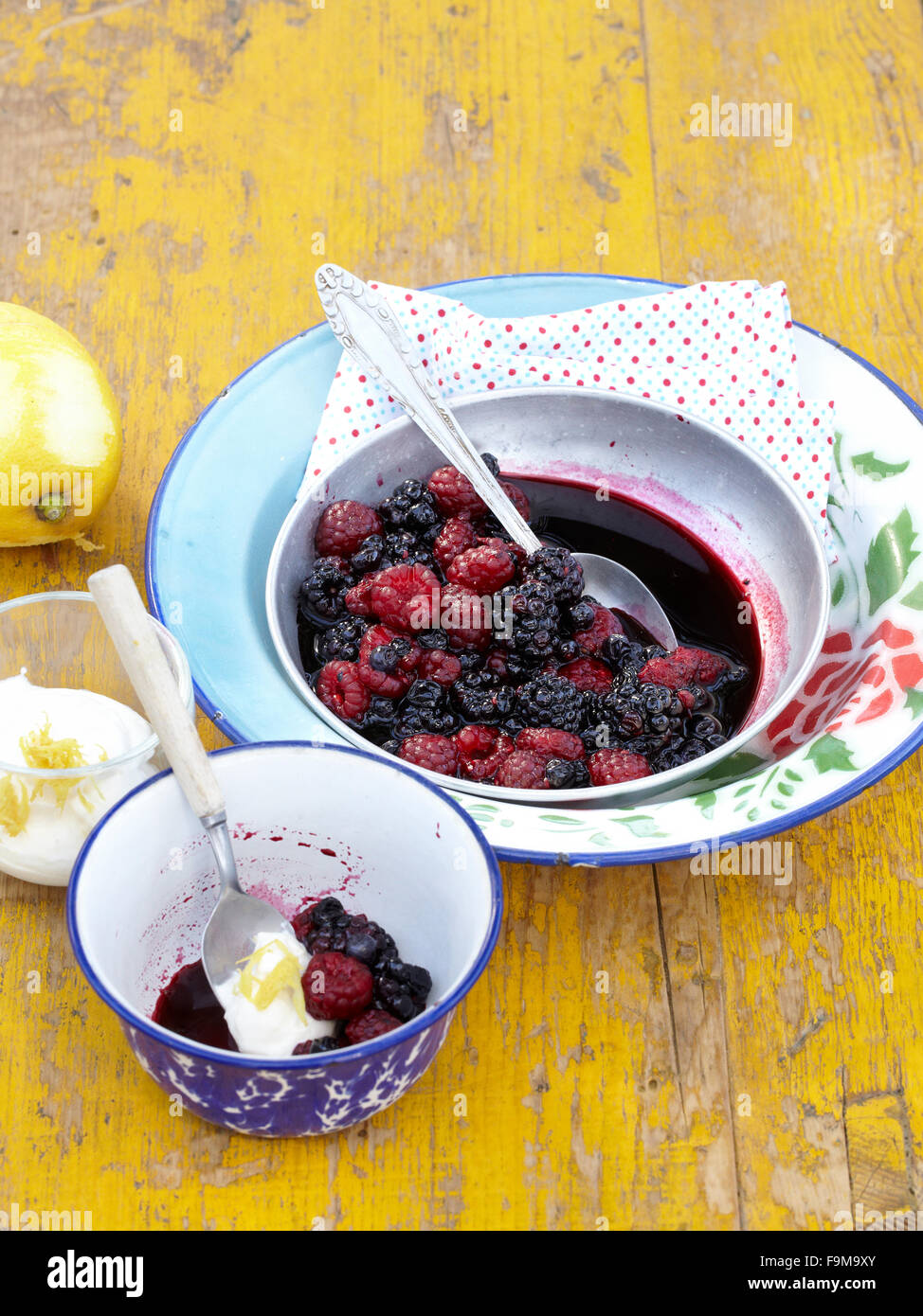 Lemon cream and hot forest berries Stock Photo - Alamy