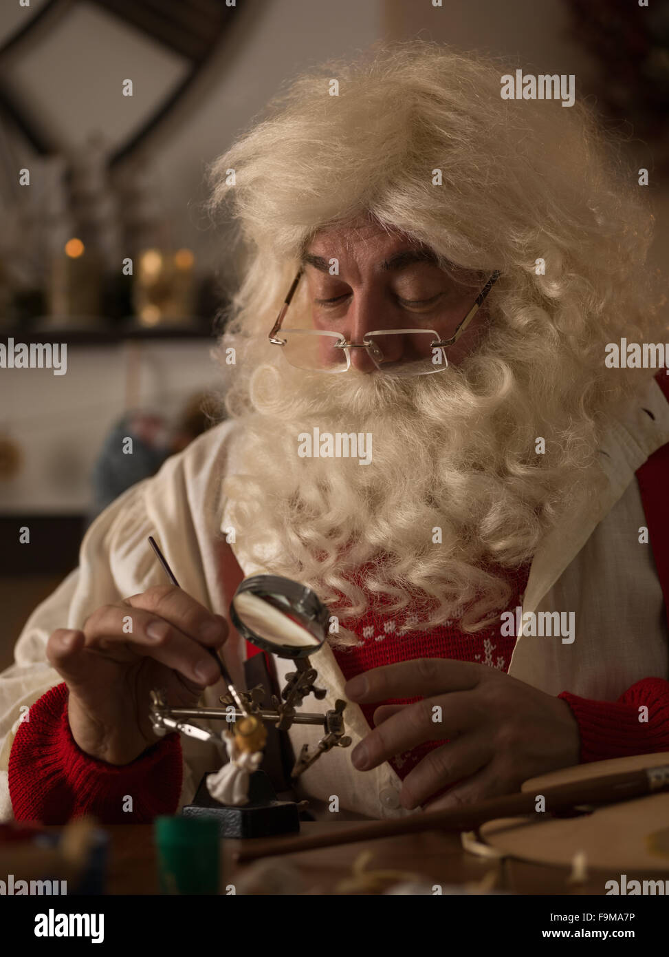 Santa Claus Working at Home with his Cat. Making Toys for Children ...