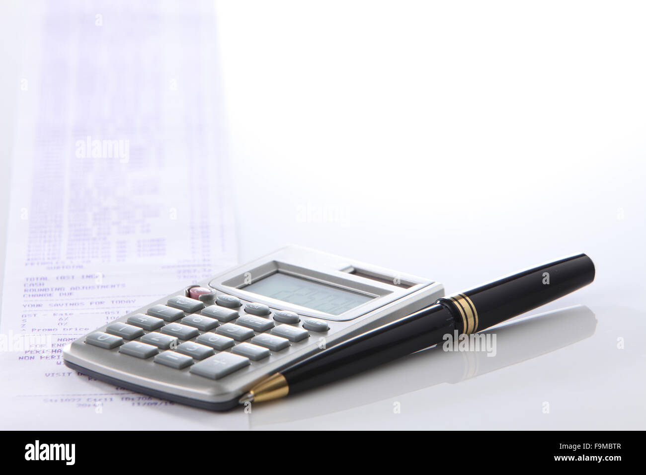 shopping receipt and calculator Stock Photo - Alamy