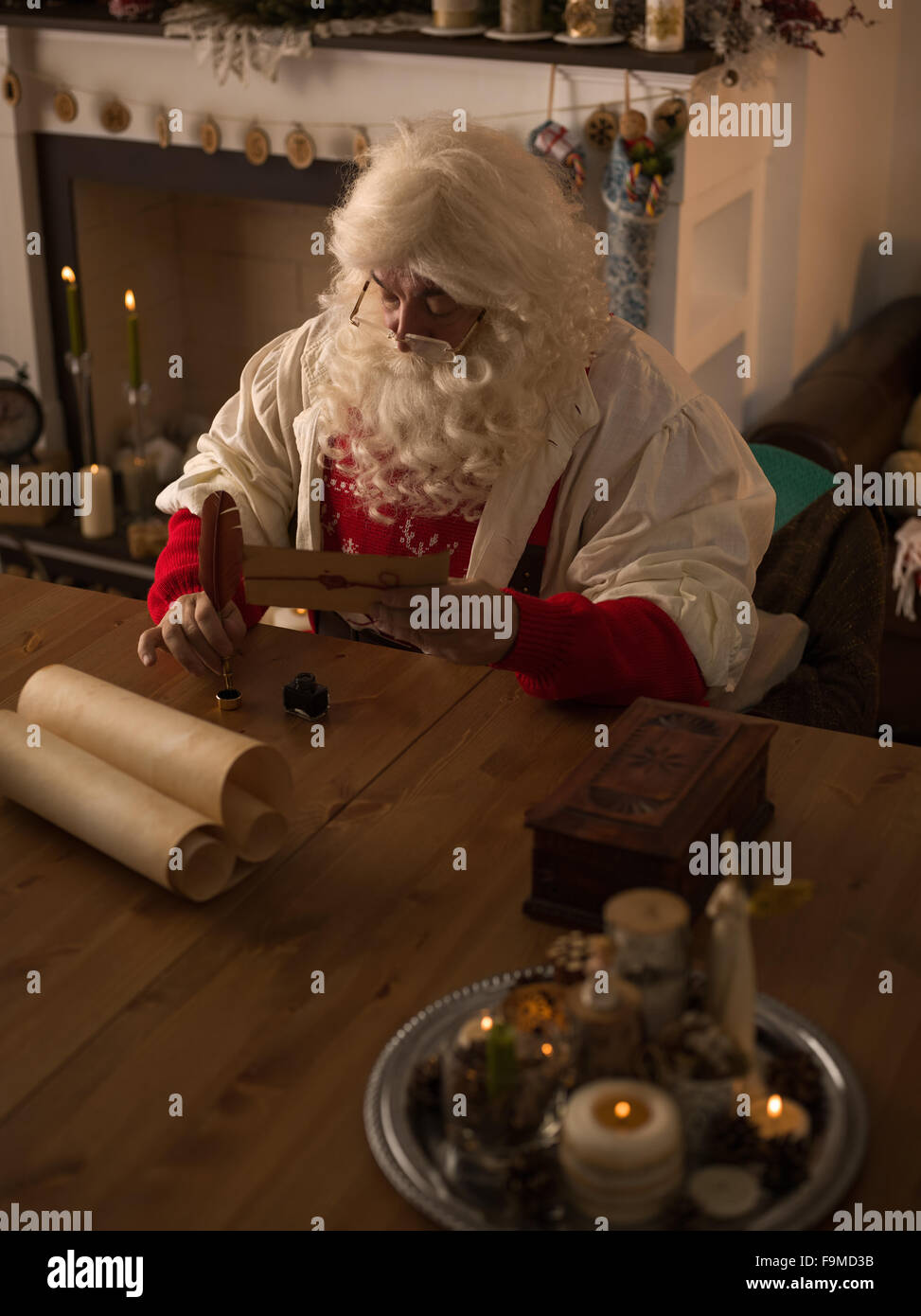 Santa Claus Working at Home. Reading and Writing letters for Children ...