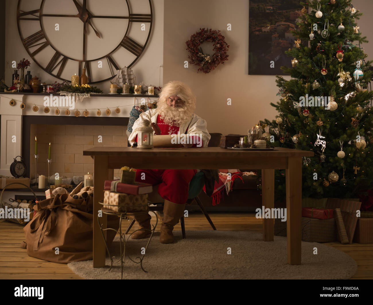 Santa Claus Working at Home. Reading and Writing letters for Children ...