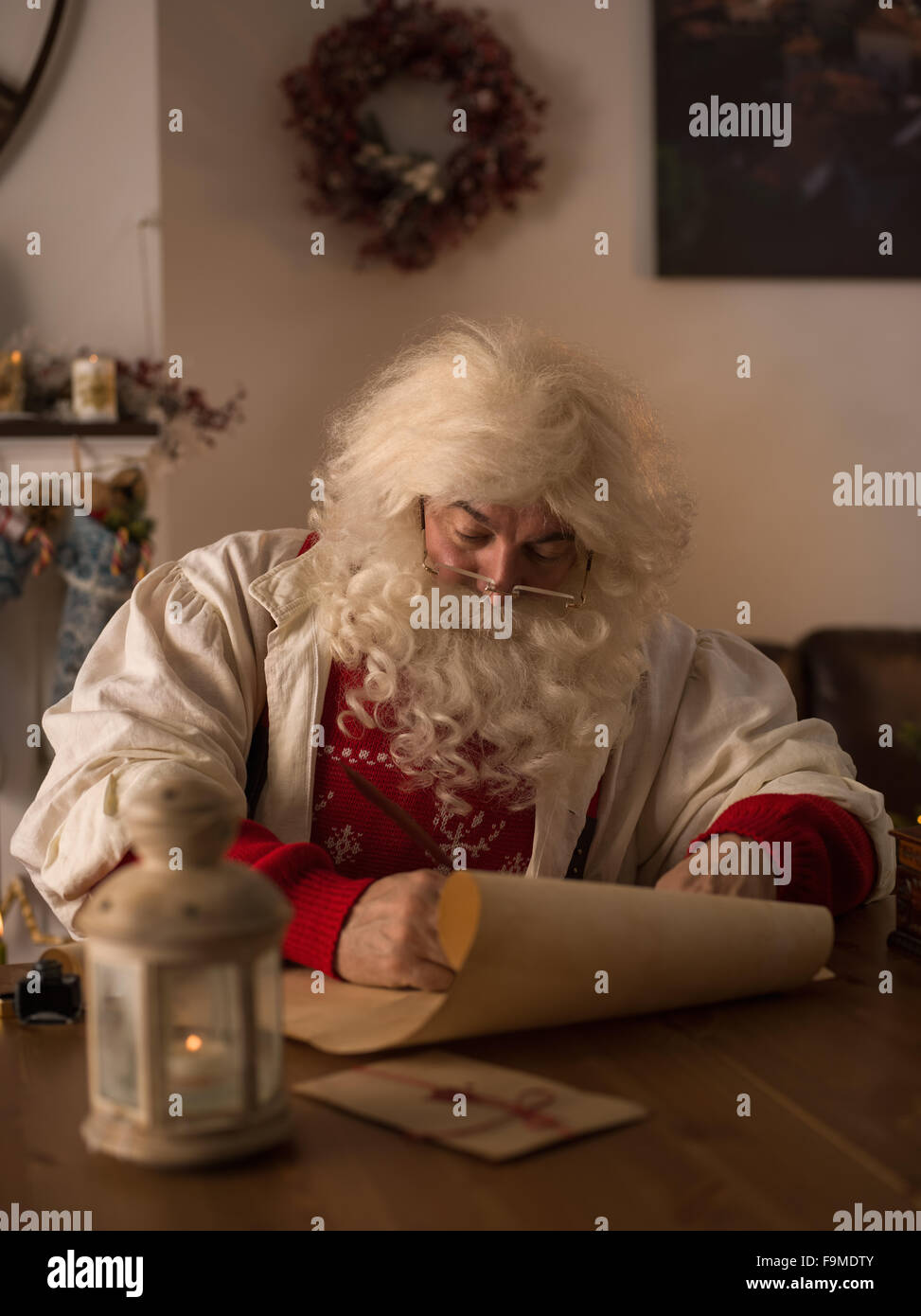 Santa Claus Working at Home. Reading and Writing letters for Children ...
