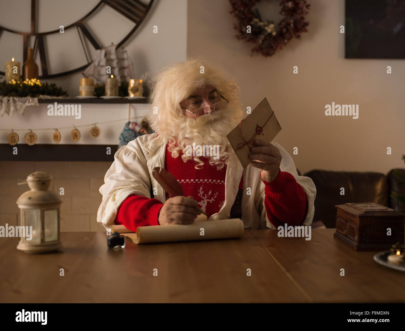 Santa Claus Working at Home. Reading and Writing letters for Children ...