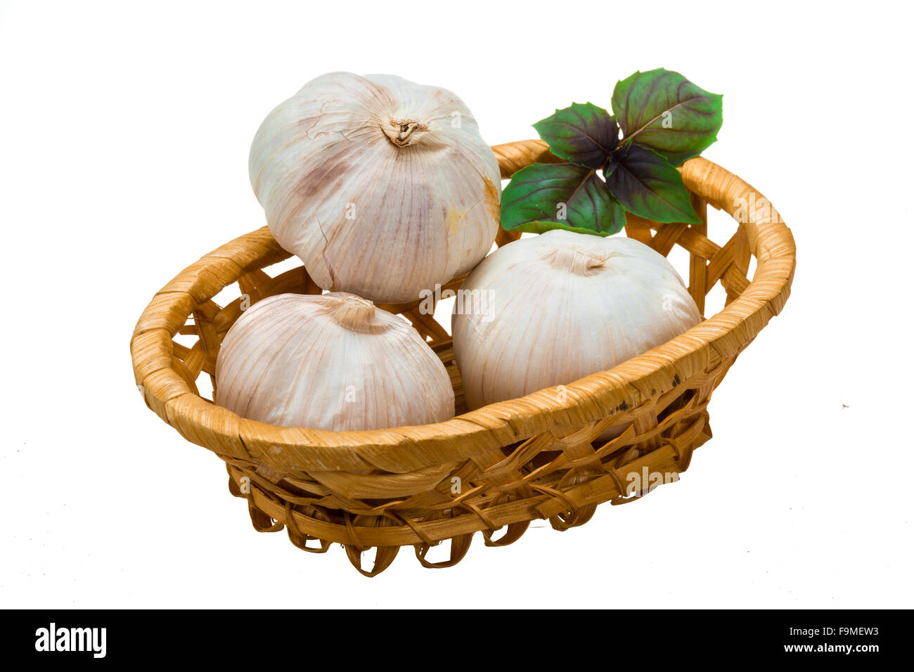Ripe garlic with basil leaf Stock Photo - Alamy