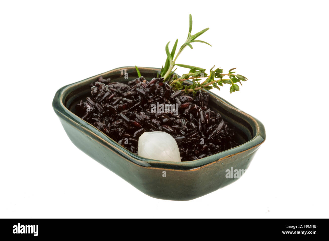 Black boiled rice with thyme Stock Photo - Alamy