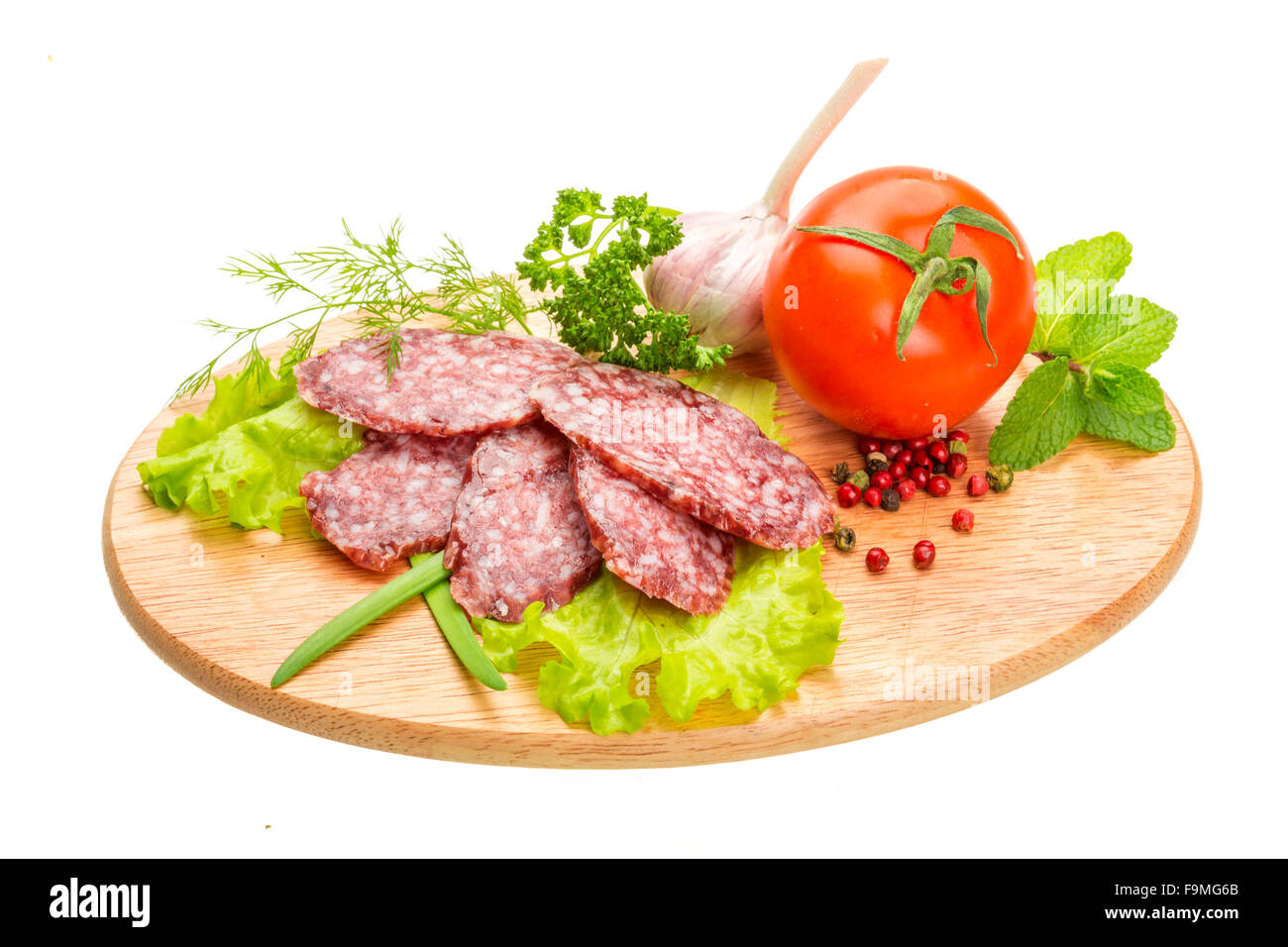 Fresh ripe salami with vegetables Stock Photo - Alamy
