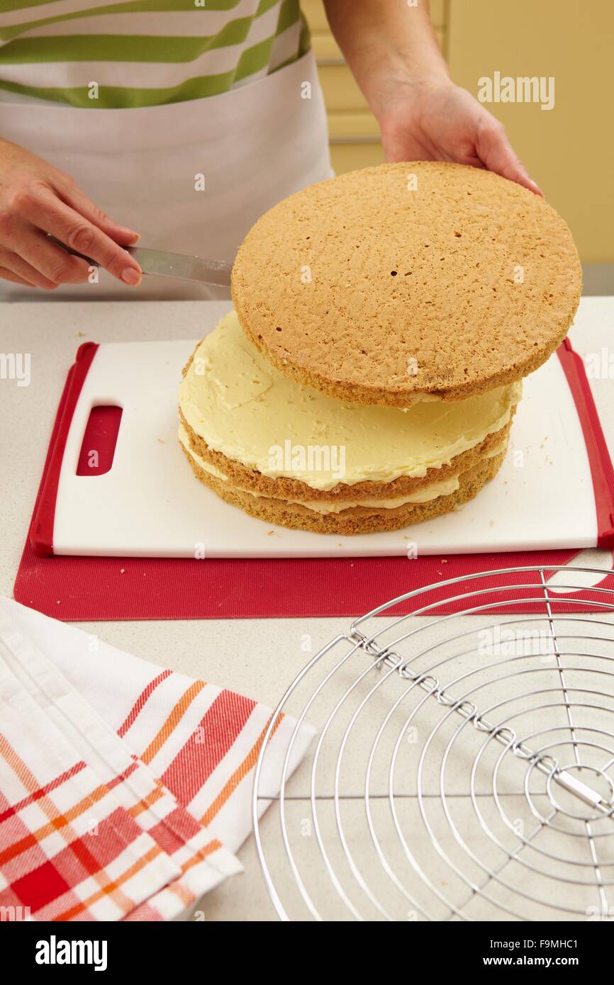 Festive three layer cake + steps Stock Photo - Alamy