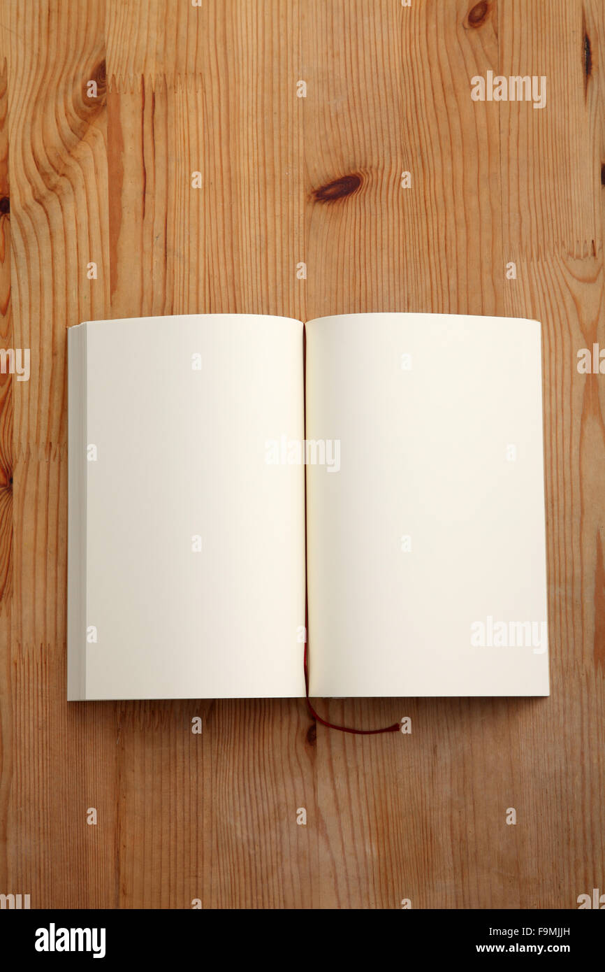 open book on the brown table Stock Photo - Alamy