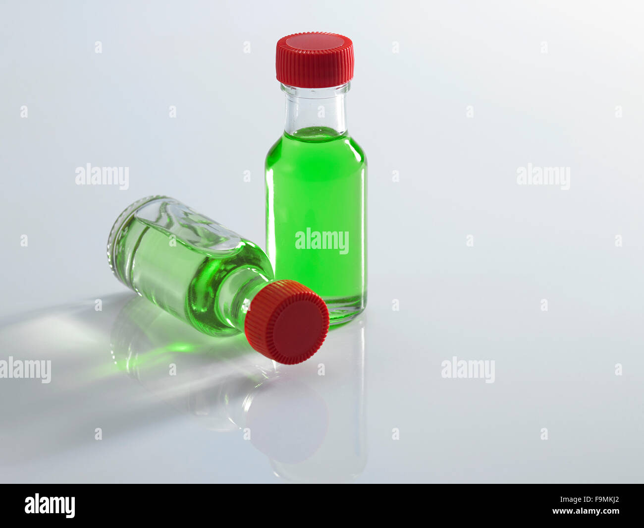 bottles of food coloring on the white background Stock Photo - Alamy