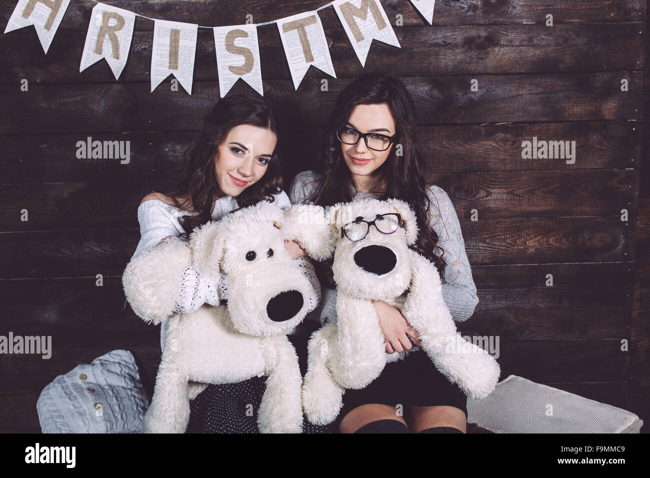 Two charming girls playing Stock Photo - Alamy