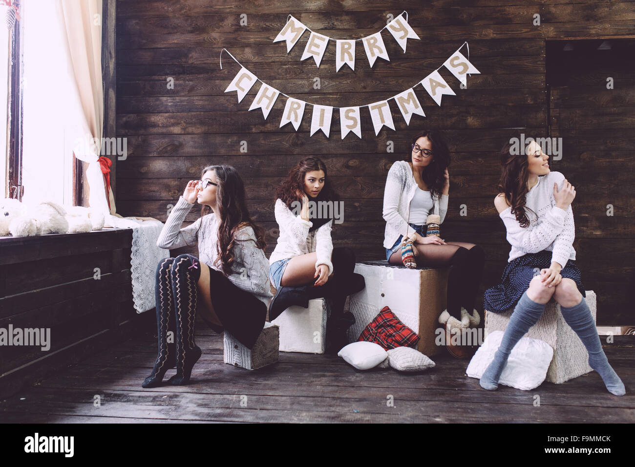 Four charming model posing Stock Photo - Alamy