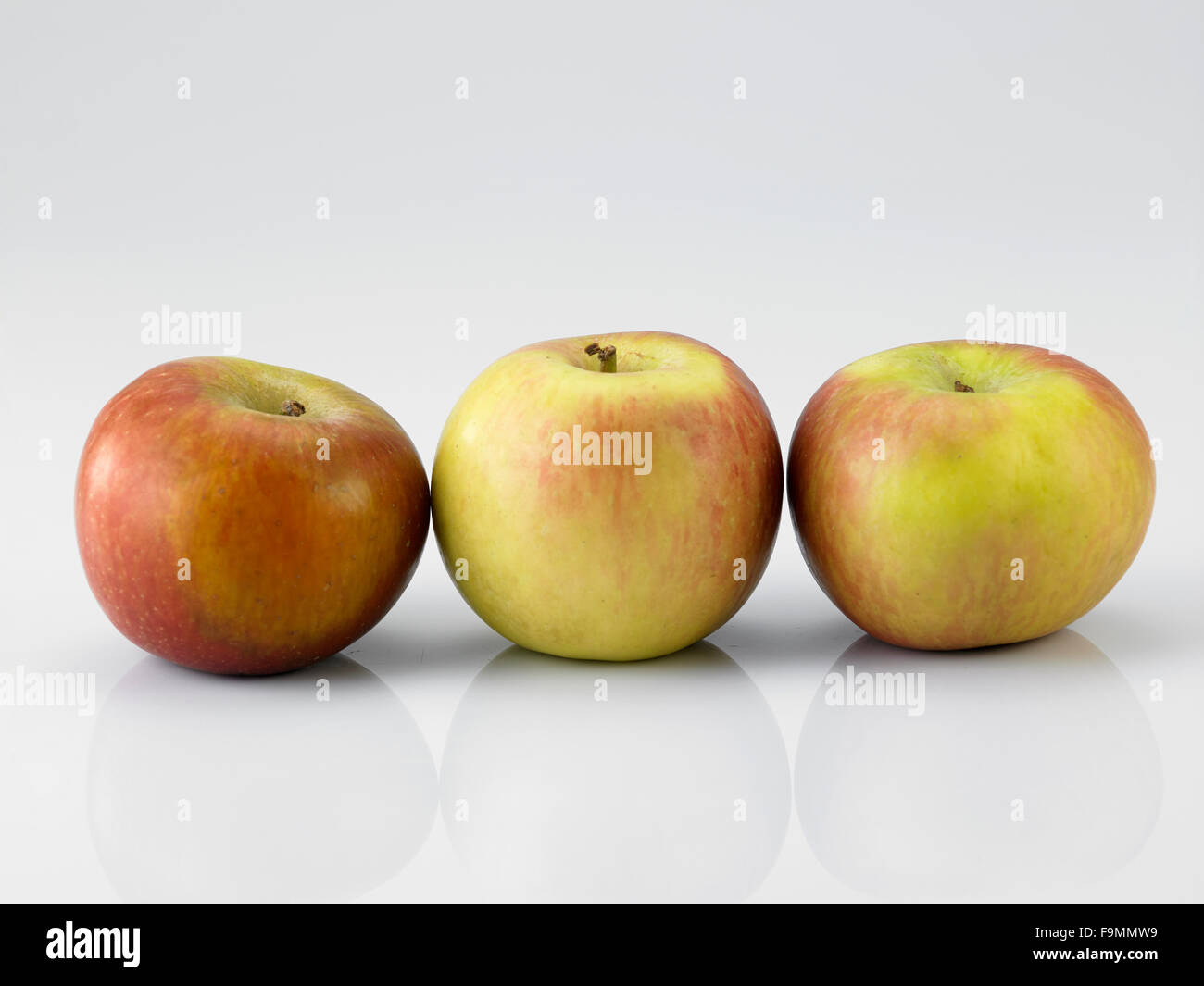 three apples in a row Stock Photo - Alamy
