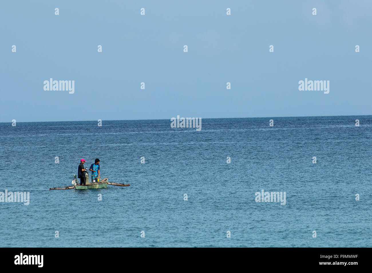 Fishing in traditional boat off Tip of Borneo Beach Sabah East Malaysia ...
