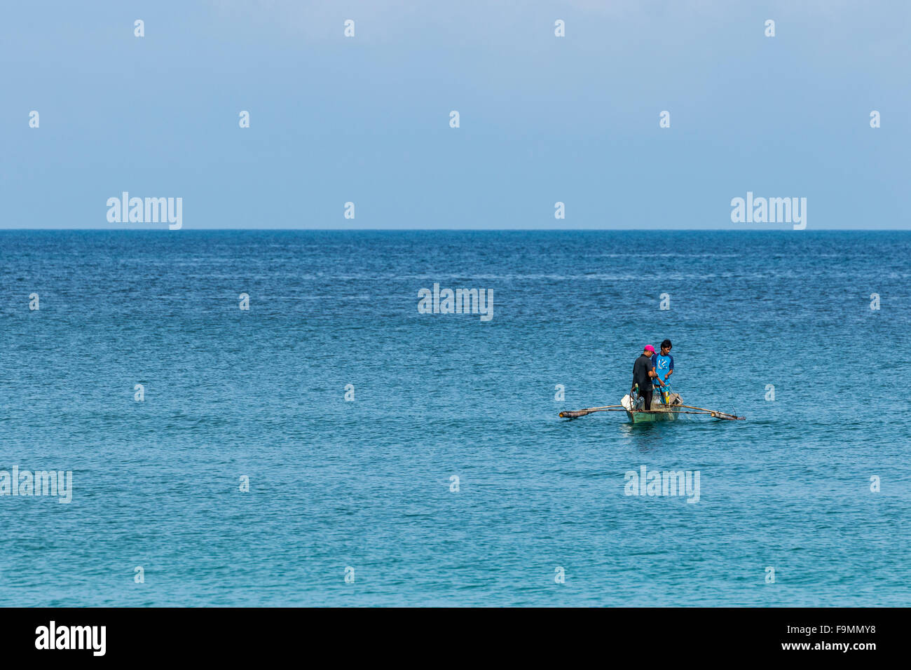 Fishing in traditional boat off Tip of Borneo Beach Sabah East Malaysia ...