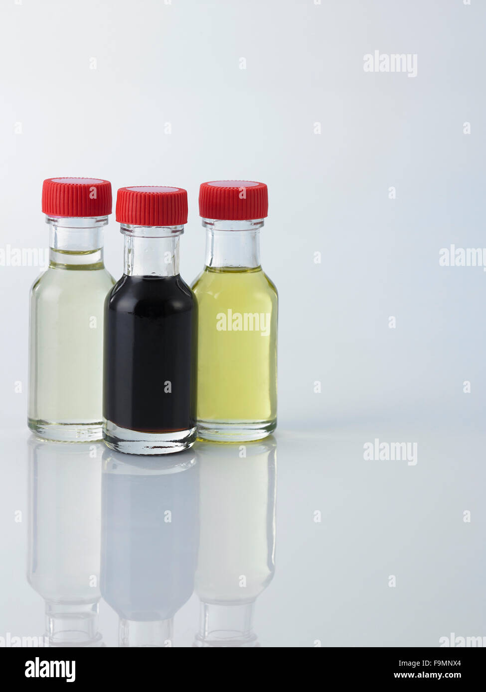 bottles of food coloring on the white background Stock Photo - Alamy