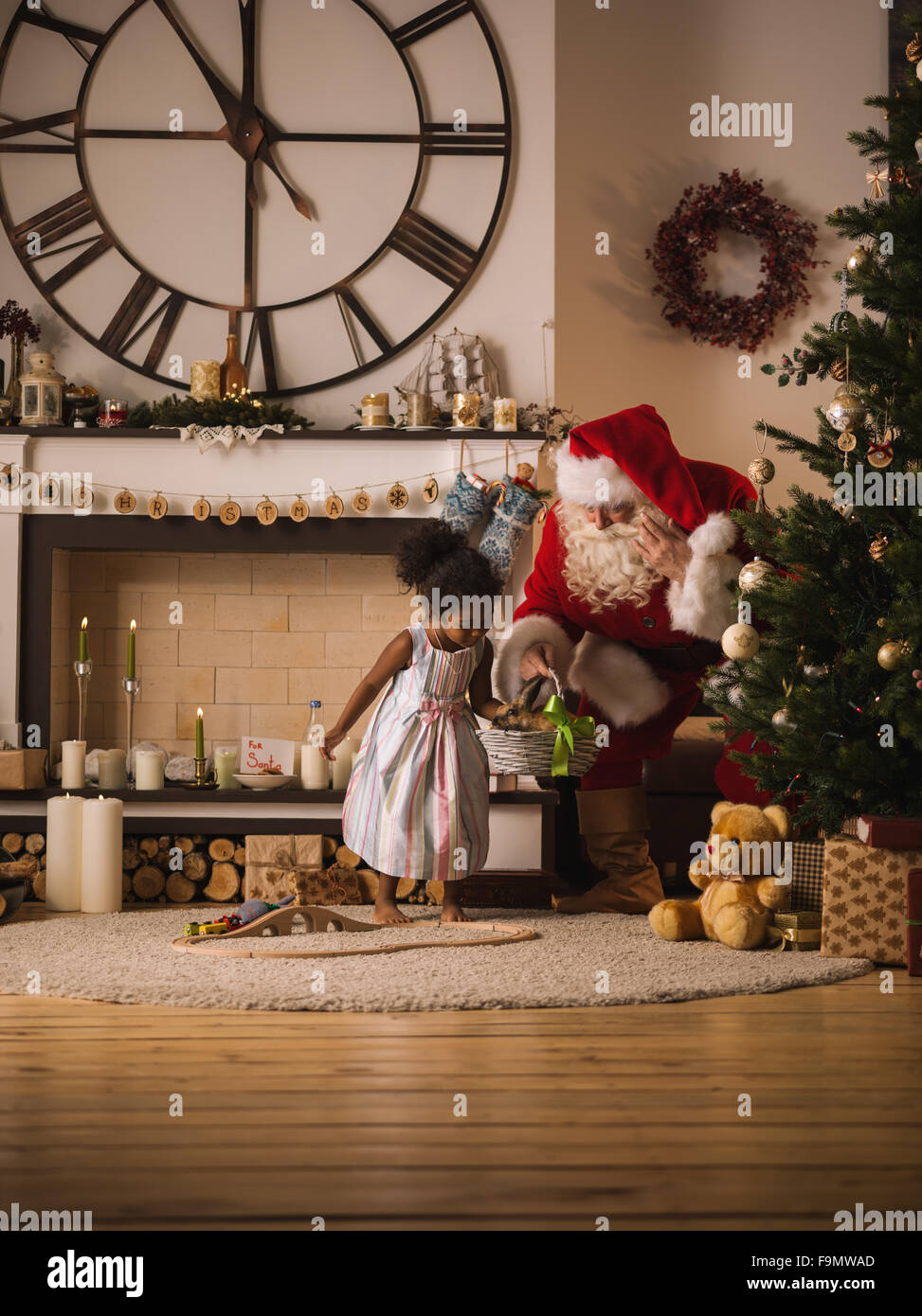 Santa Claus with Child playing at Home Stock Photo - Alamy