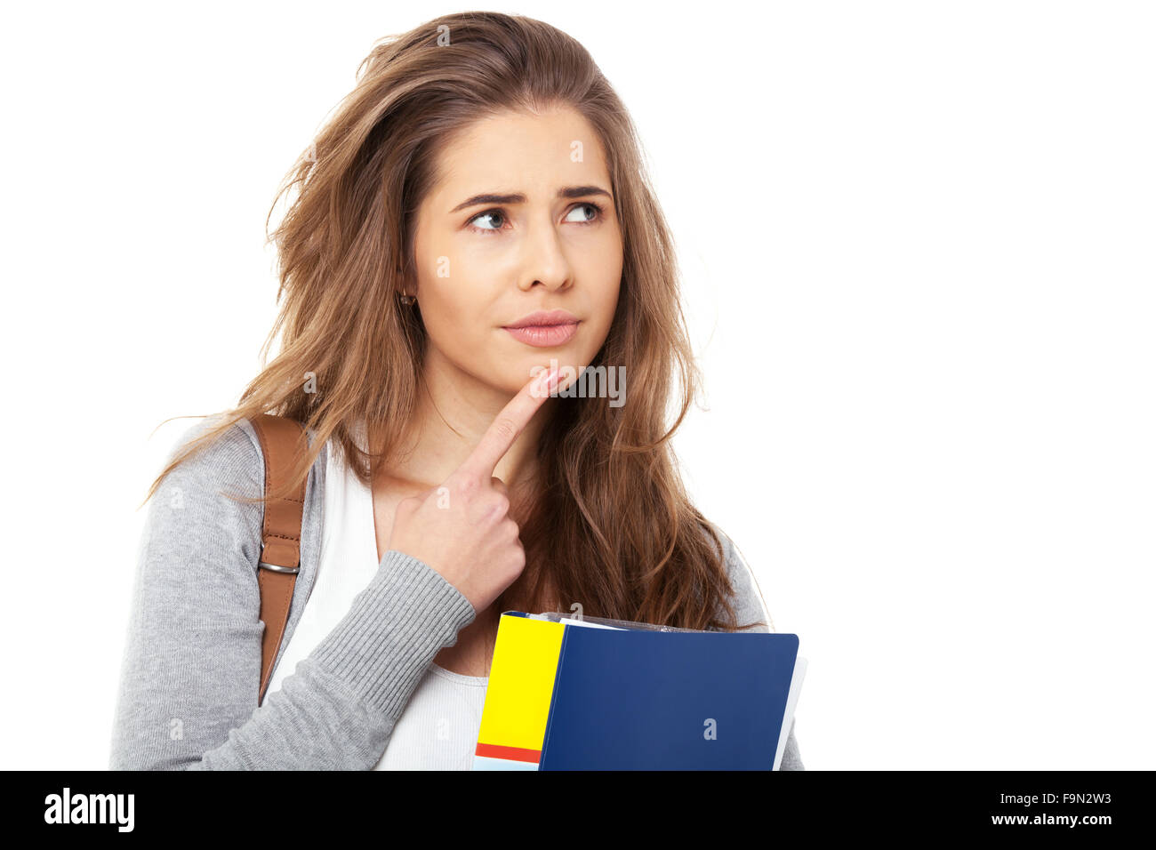 Thoughtful young female student isolated on white background Stock ...