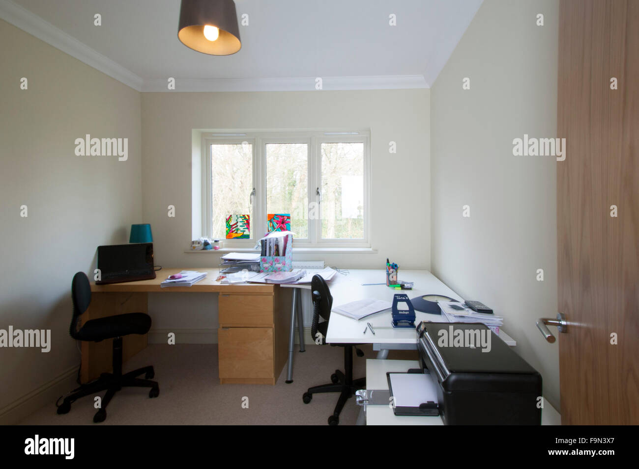 A home office with two desks and stationary Stock Photo - Alamy